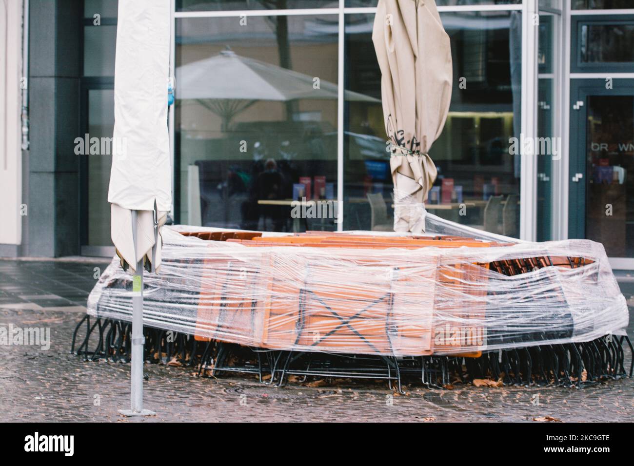 tables and chairs are stacked and tied together by plastic tapes in ...