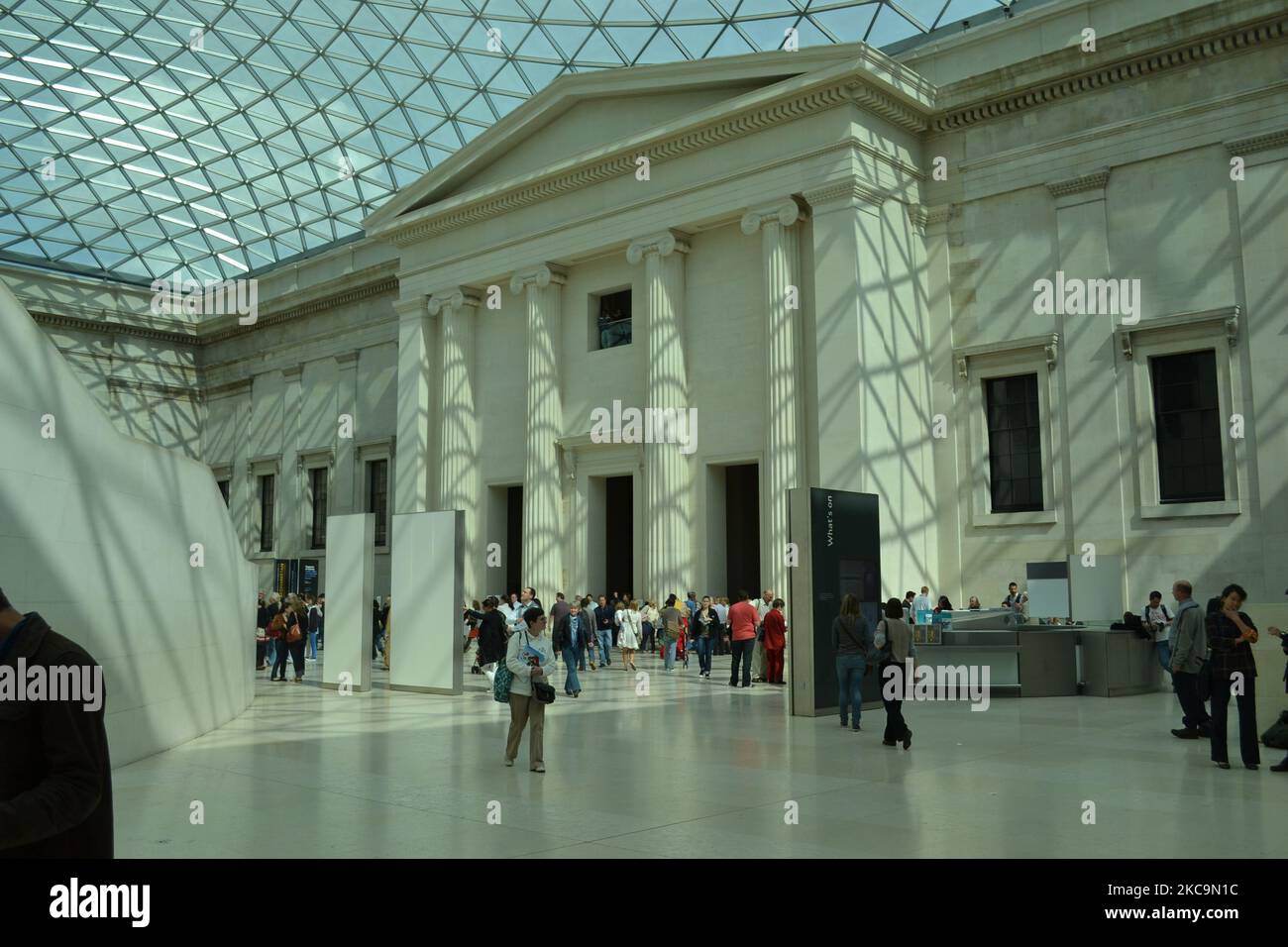 The architecture of the British Museum in London with tourists around ...