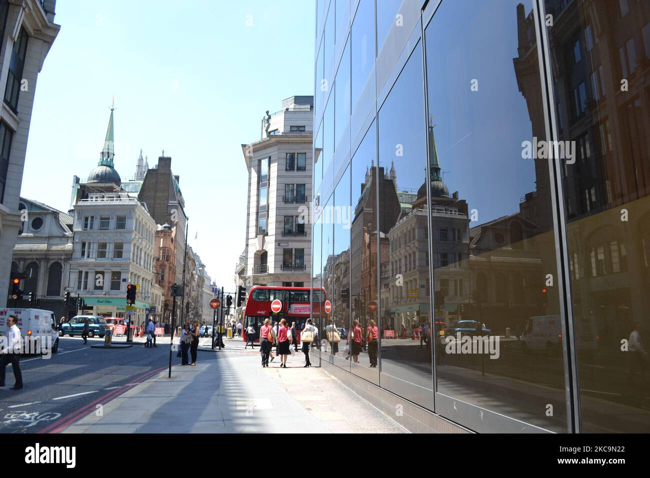 The buildings around Liverpool street in London with people on the ...