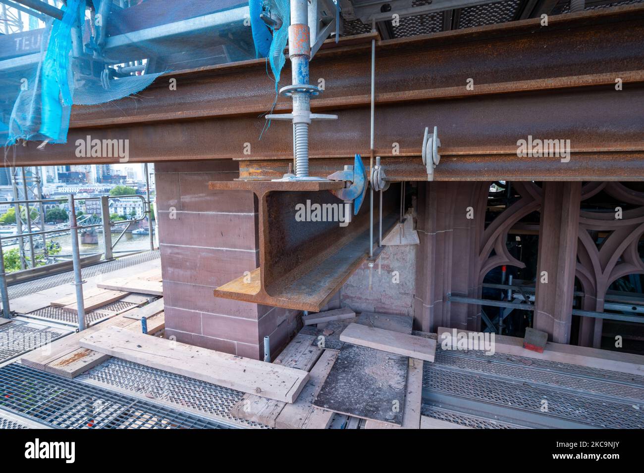 A close-up of metallic railing and scaffolding on a construction site ...