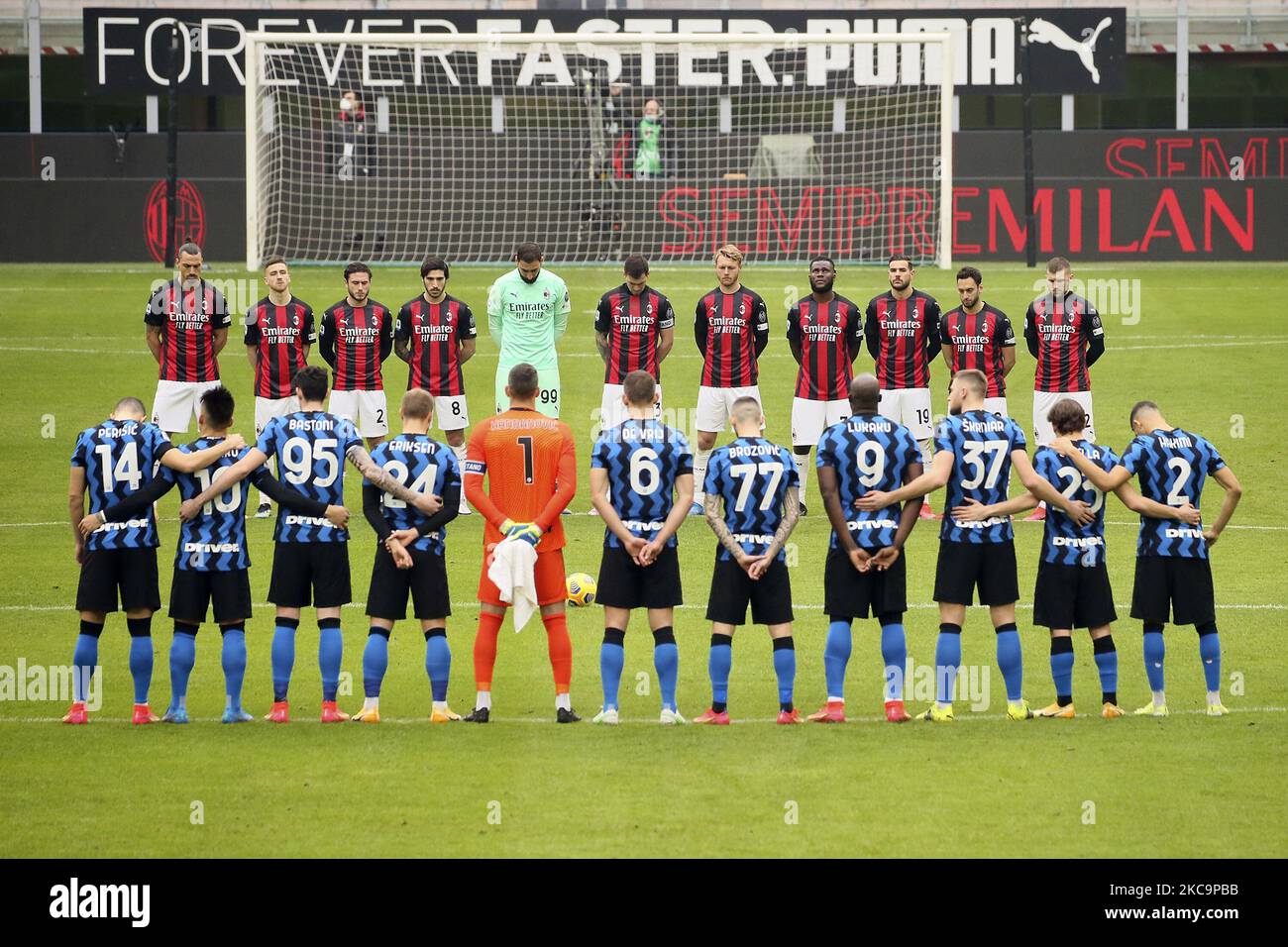 Inter players (Front) and AC Milan players hold a minute's silence in ...