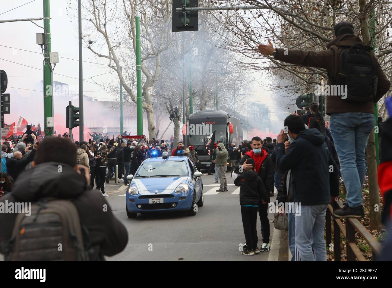 Fans of AC Milan and FC Internazionale wait outside the stadium ...