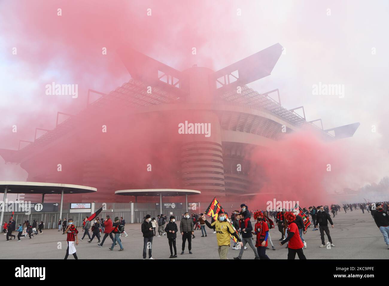 Fans of AC Milan and FC Internazionale wait outside the stadium ...