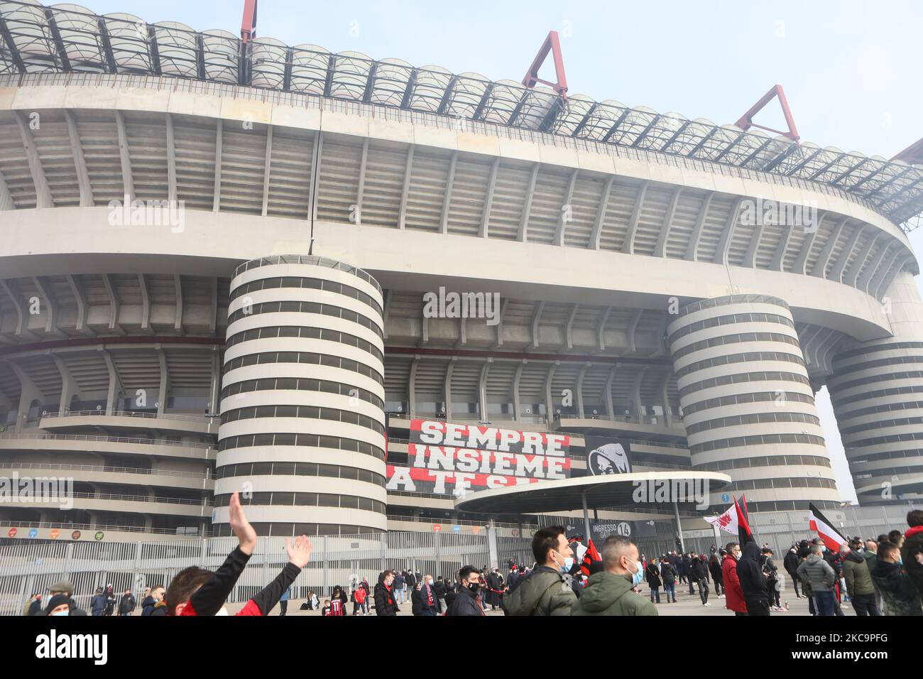 Fans of AC Milan and FC Internazionale wait outside the stadium ...