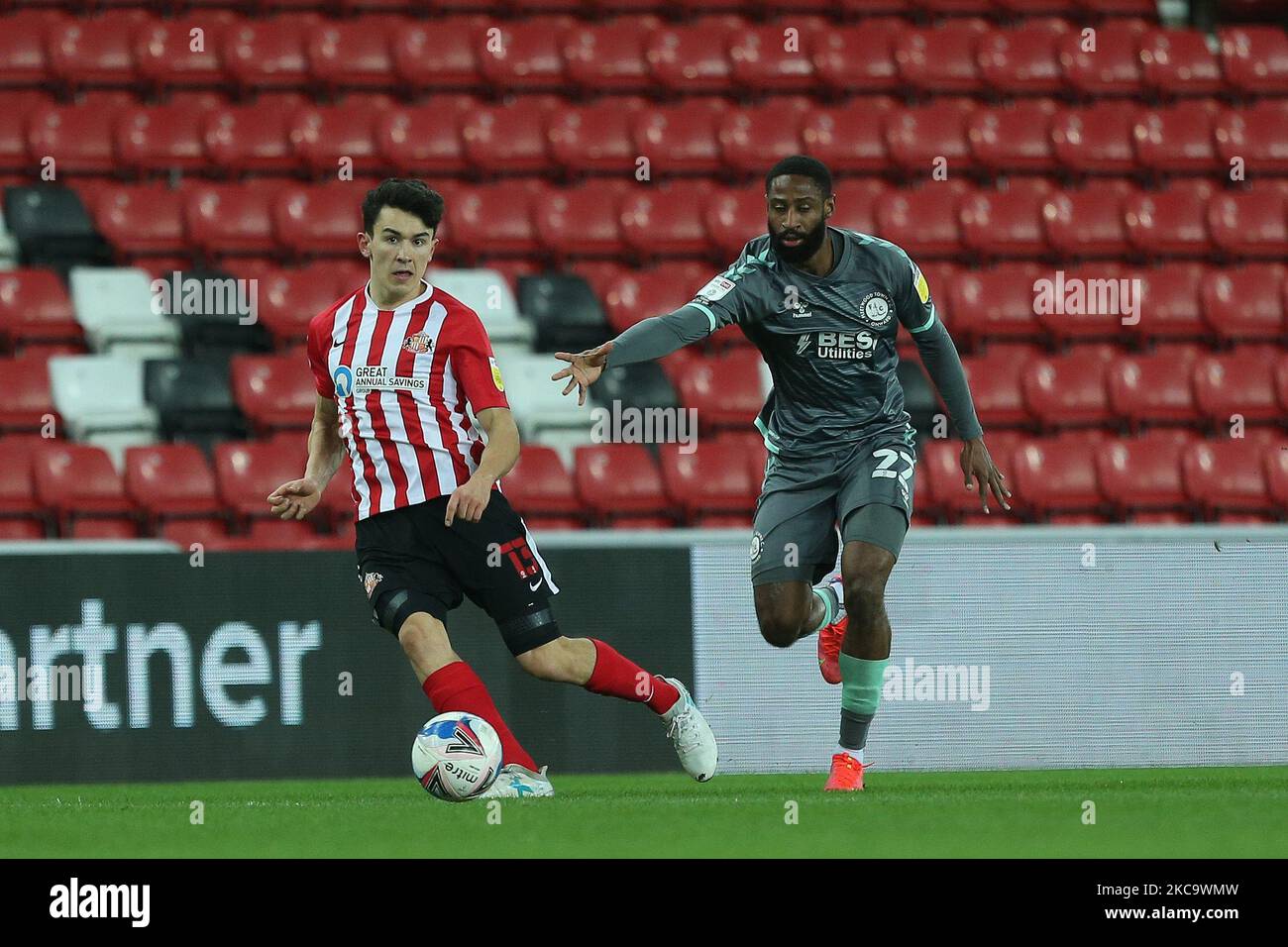 Luke O'Nien of Sunderland in action with Janoi Donacien of Fleetwood ...
