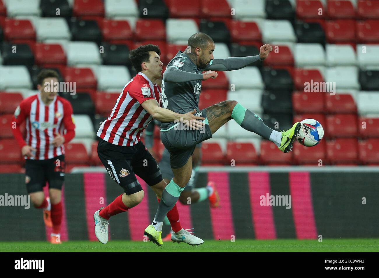 Kyle Vassell of Fleetwood Town battles with Luke O'Nien of Sunderland ...