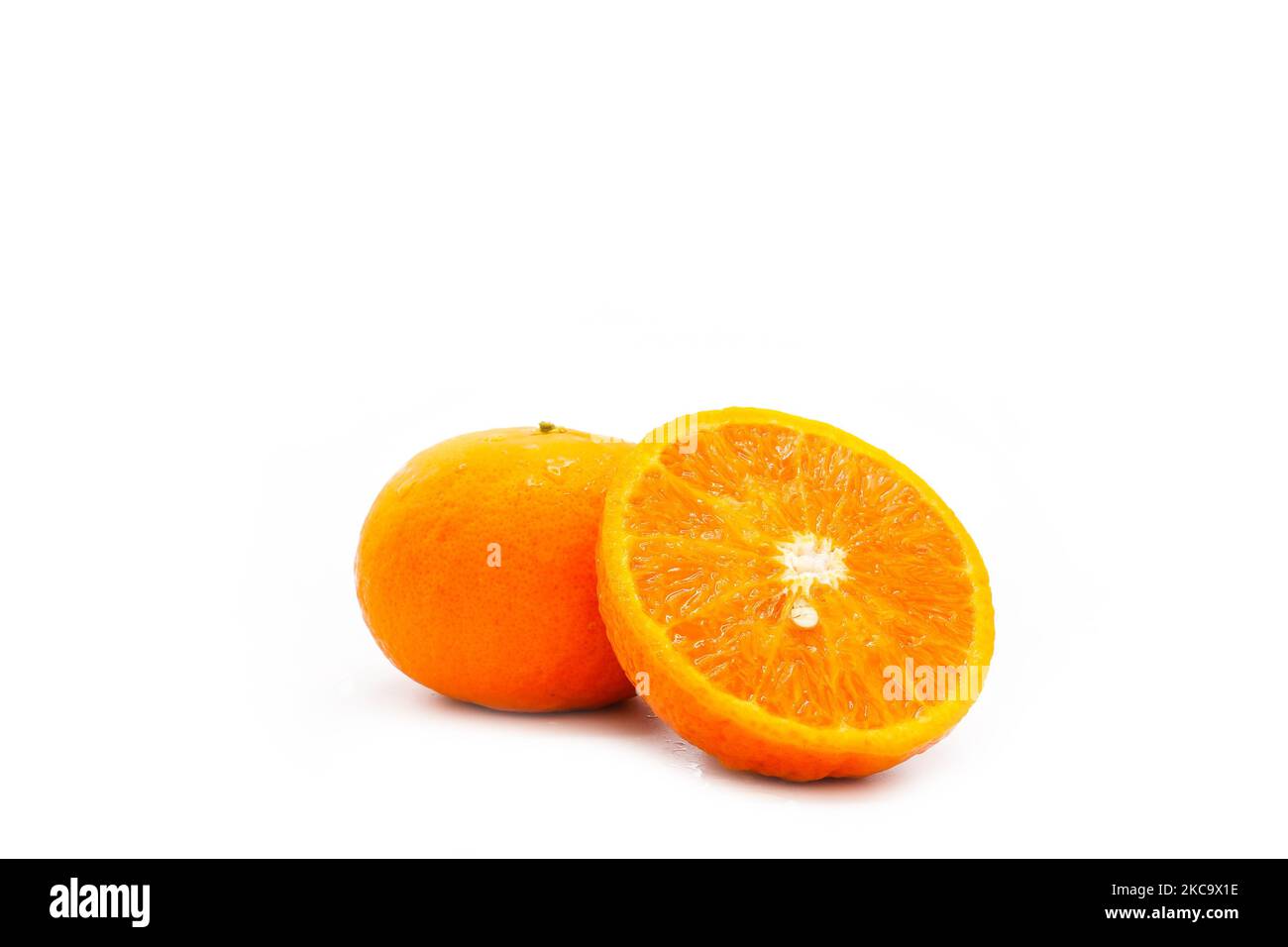 A sliced orange isolated on a white background Stock Photo - Alamy