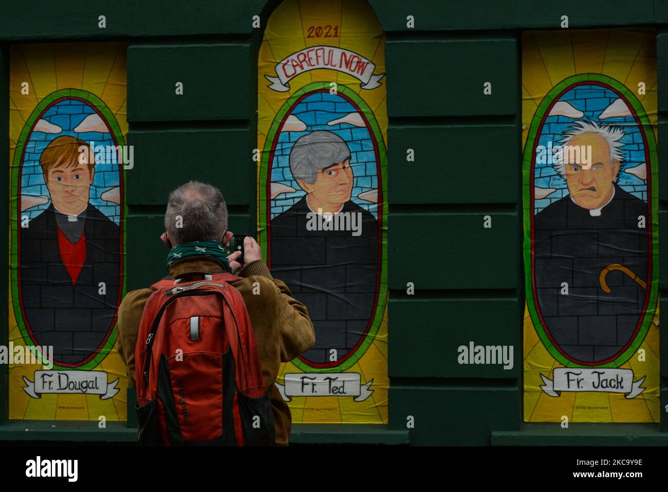 A man takes pictures of Father Dougal, Father Ted and Father Jack ...