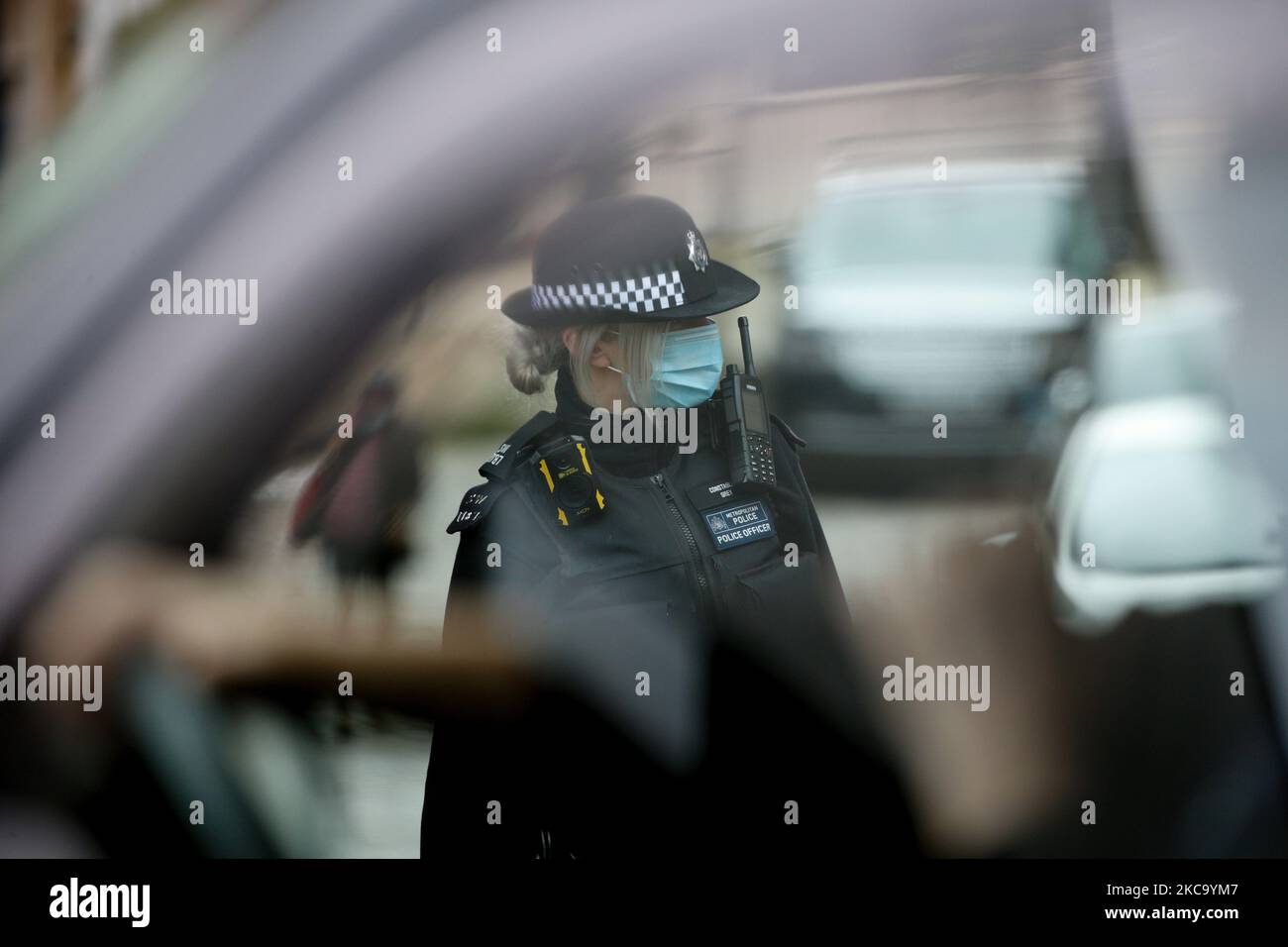 Police officers stand guard outside the King Edward VII Hospital, where ...