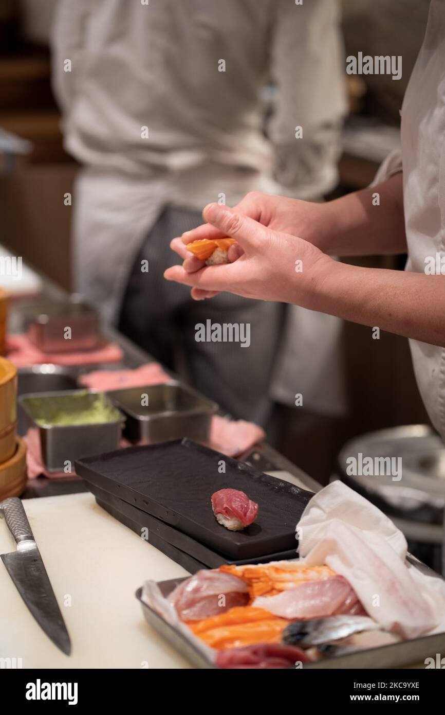 A chef making sushi in the restaurant Stock Photo - Alamy