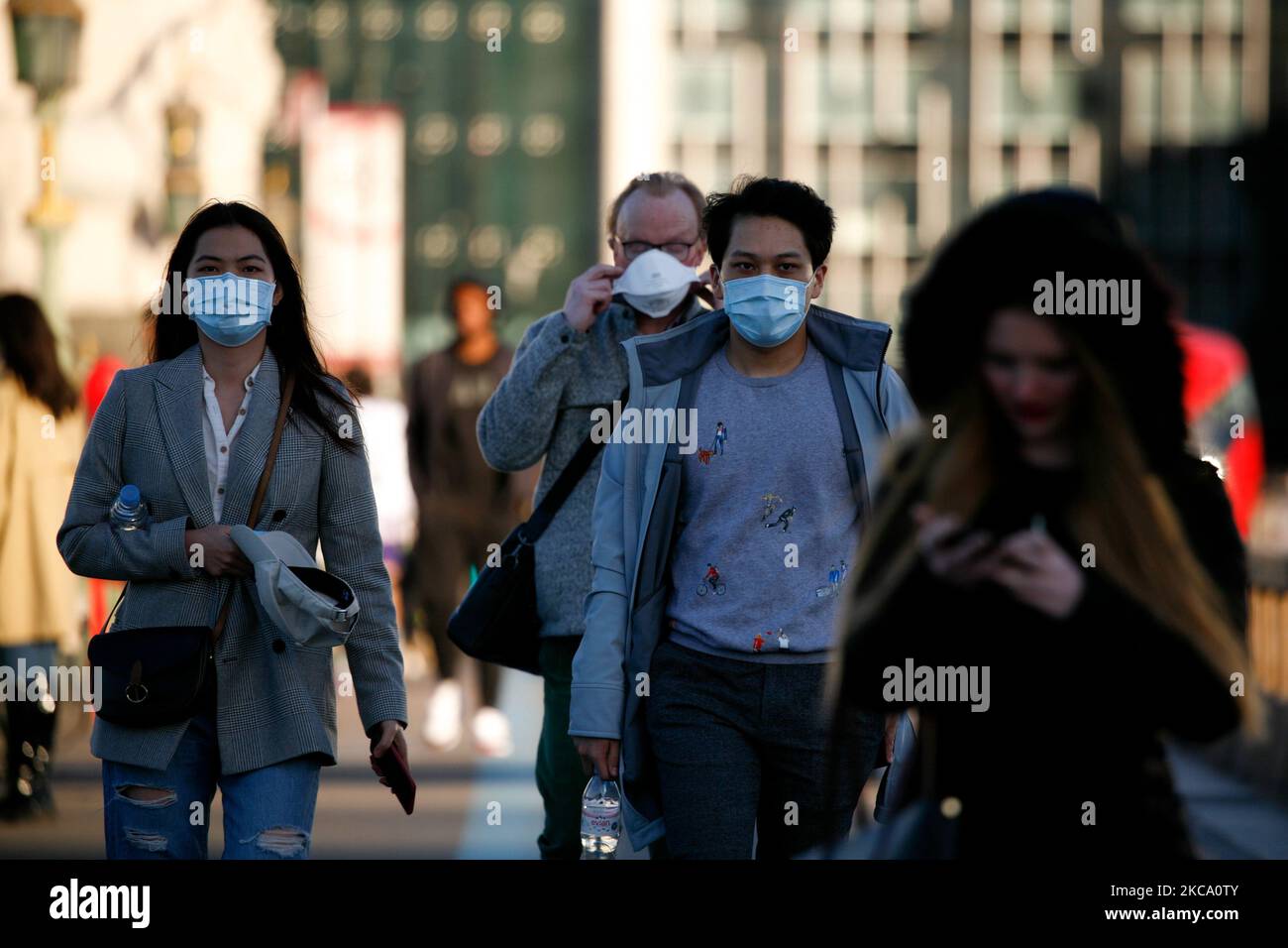 Face masks cross westminster bridge hi-res stock photography and images ...