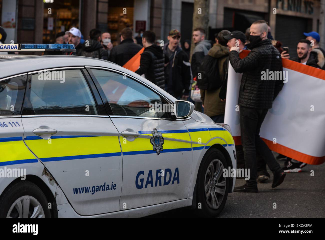 A group of Anti-Lockdown protesters blocking a Garda car on O'Connell ...