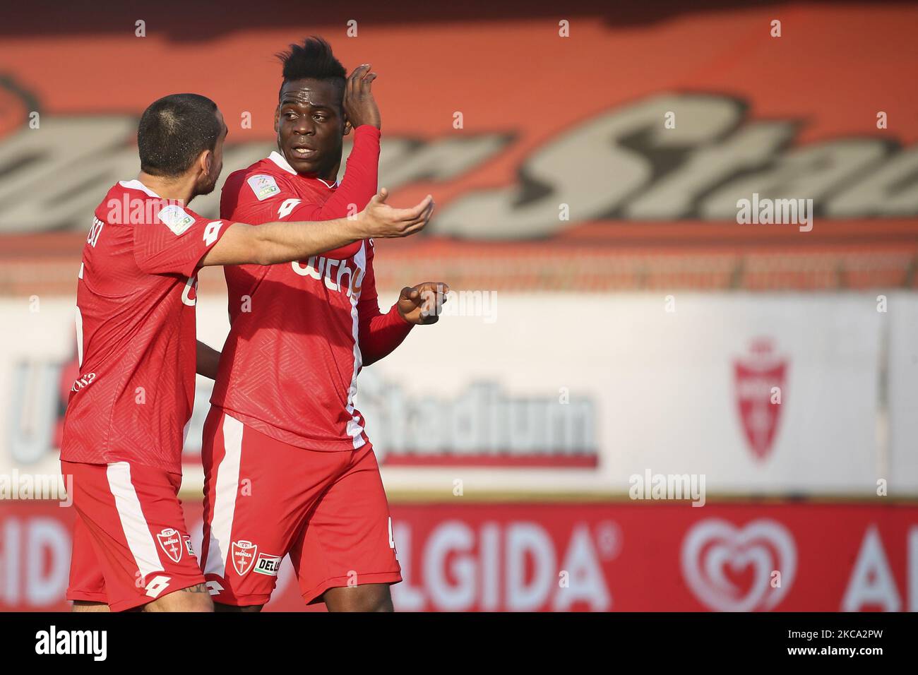 Giuseppe Bellusci (L) of AC Monza and Mario Balotelli (R) during the ...