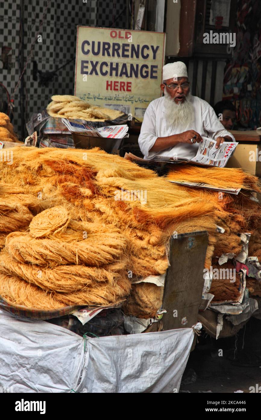 Muslim man selling seviyan (sweet vermicelli) at a market food stall ...