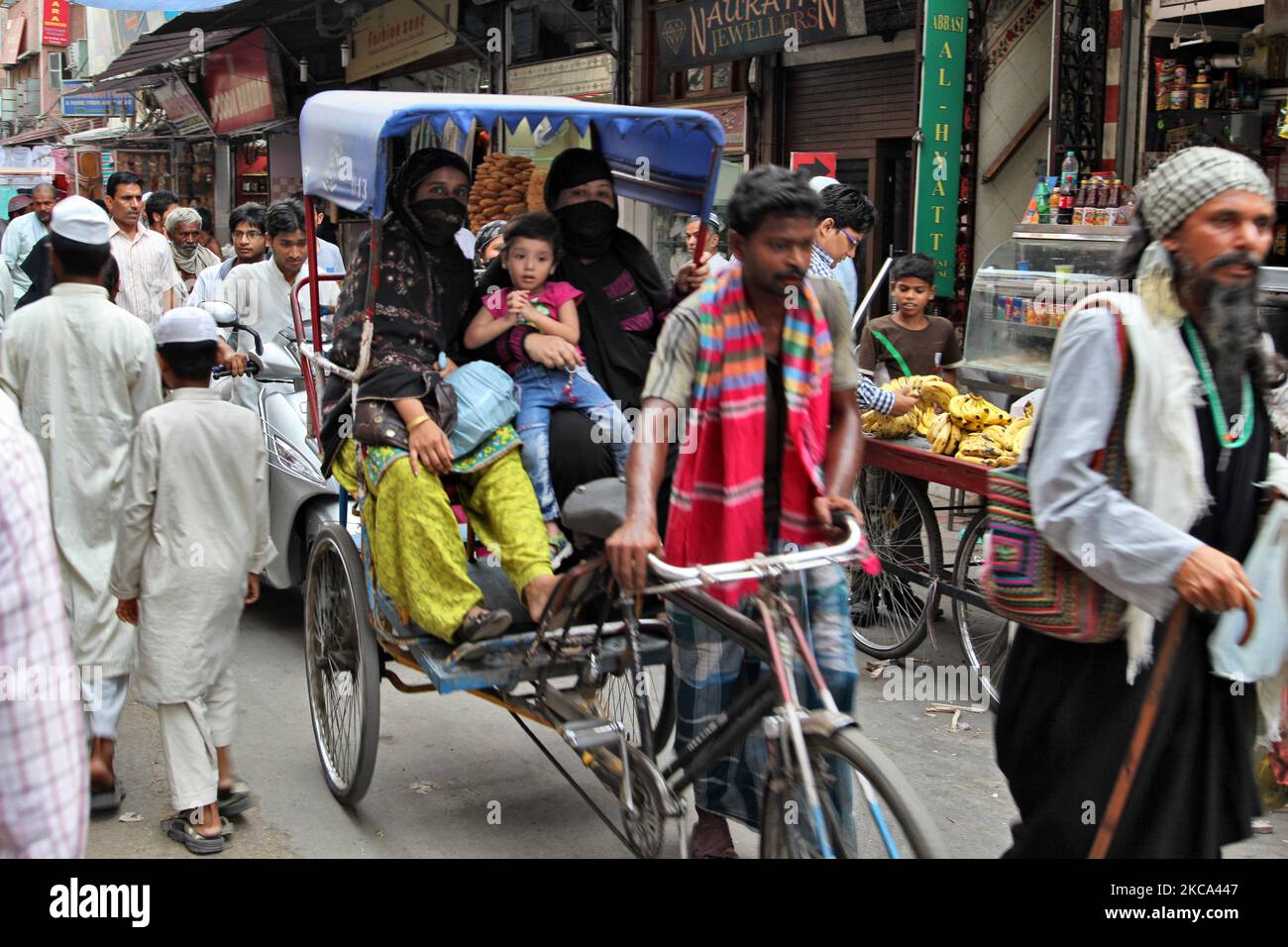 Crowded street at a market near the Jamia Masjid in Old Delhi, India ...