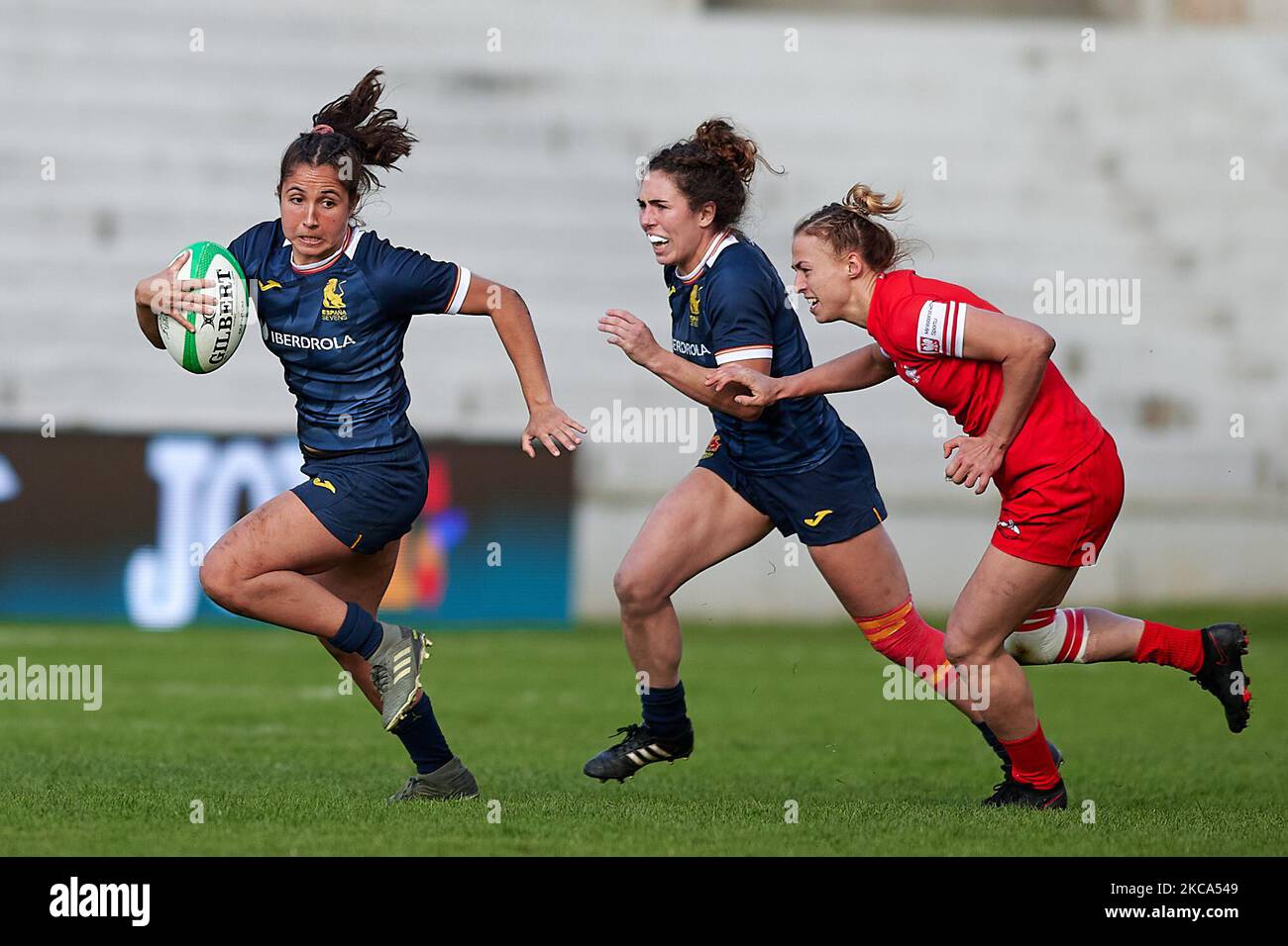 Players In action during the Madrid Rugby 7s match between Spain and ...