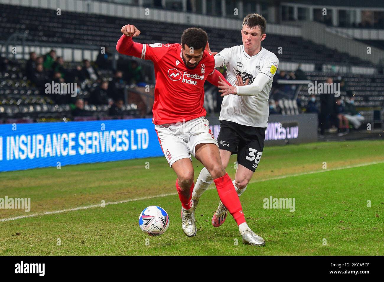 Cyrus Christie (2) of Nottingham Forest shields the ball from Jason ...