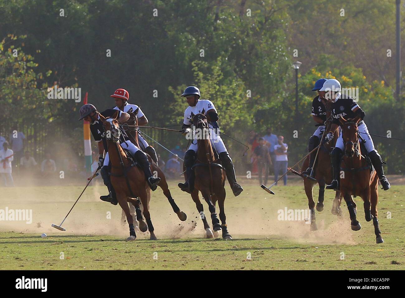 Jaipur: Players of Sona Polo and Chandna Group teams in action during ...