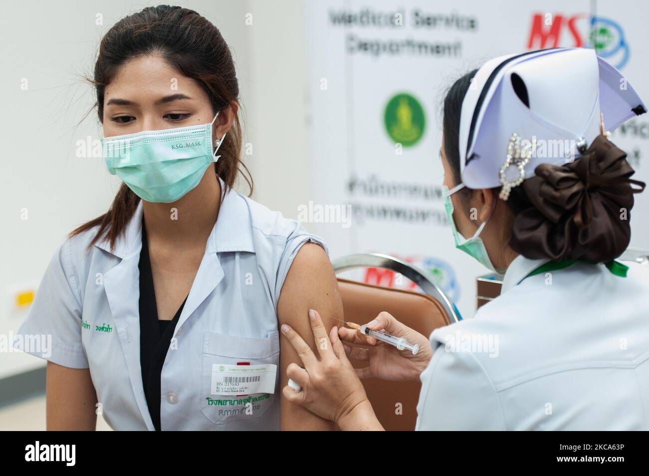 A doctor receives a dose of Sinovac Covid-19 vaccine at the Bang Khun Thian Geriatric Hospital ...