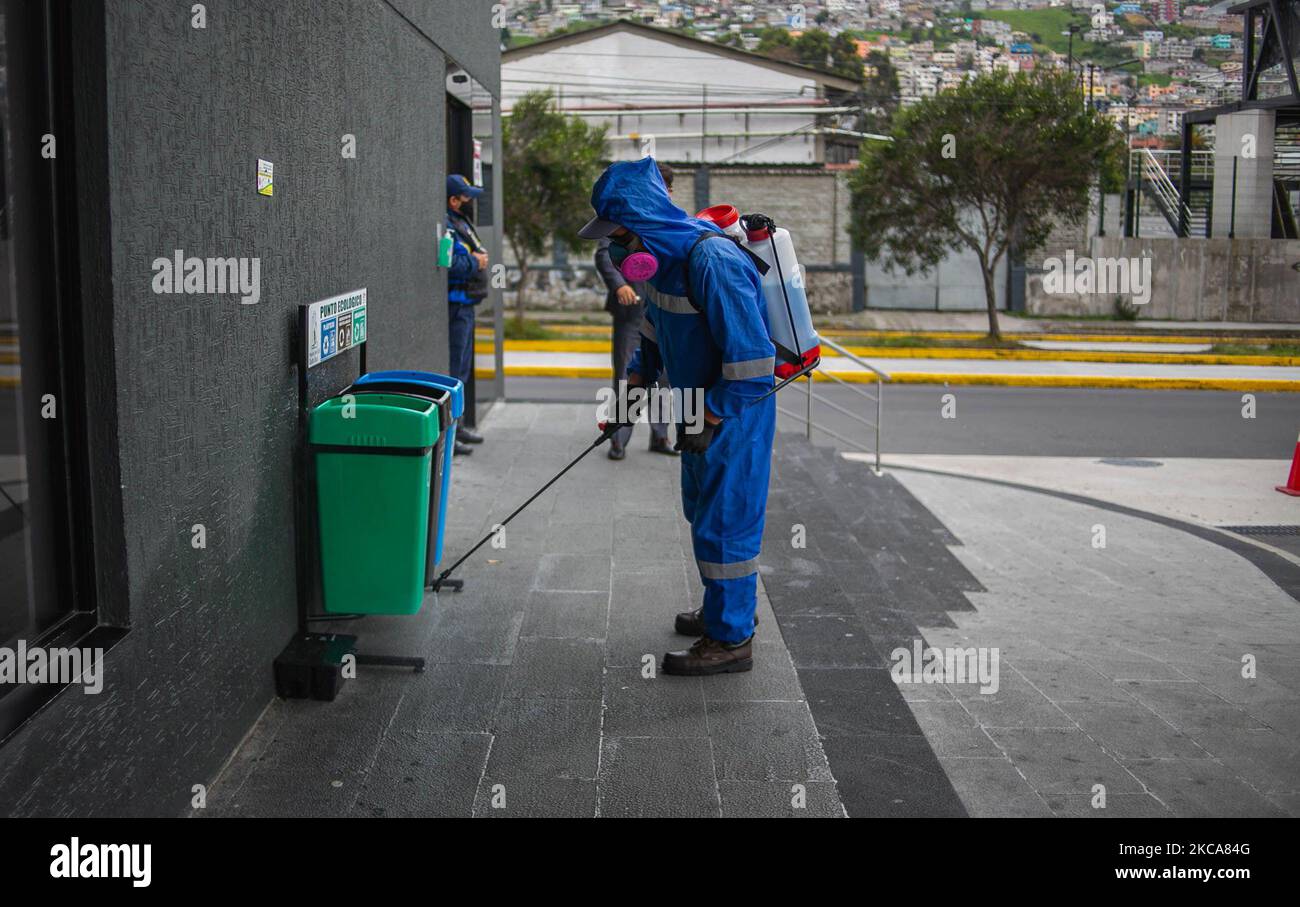 Cleaning staff disinfects sidewalks that lead to the emergency area of ...