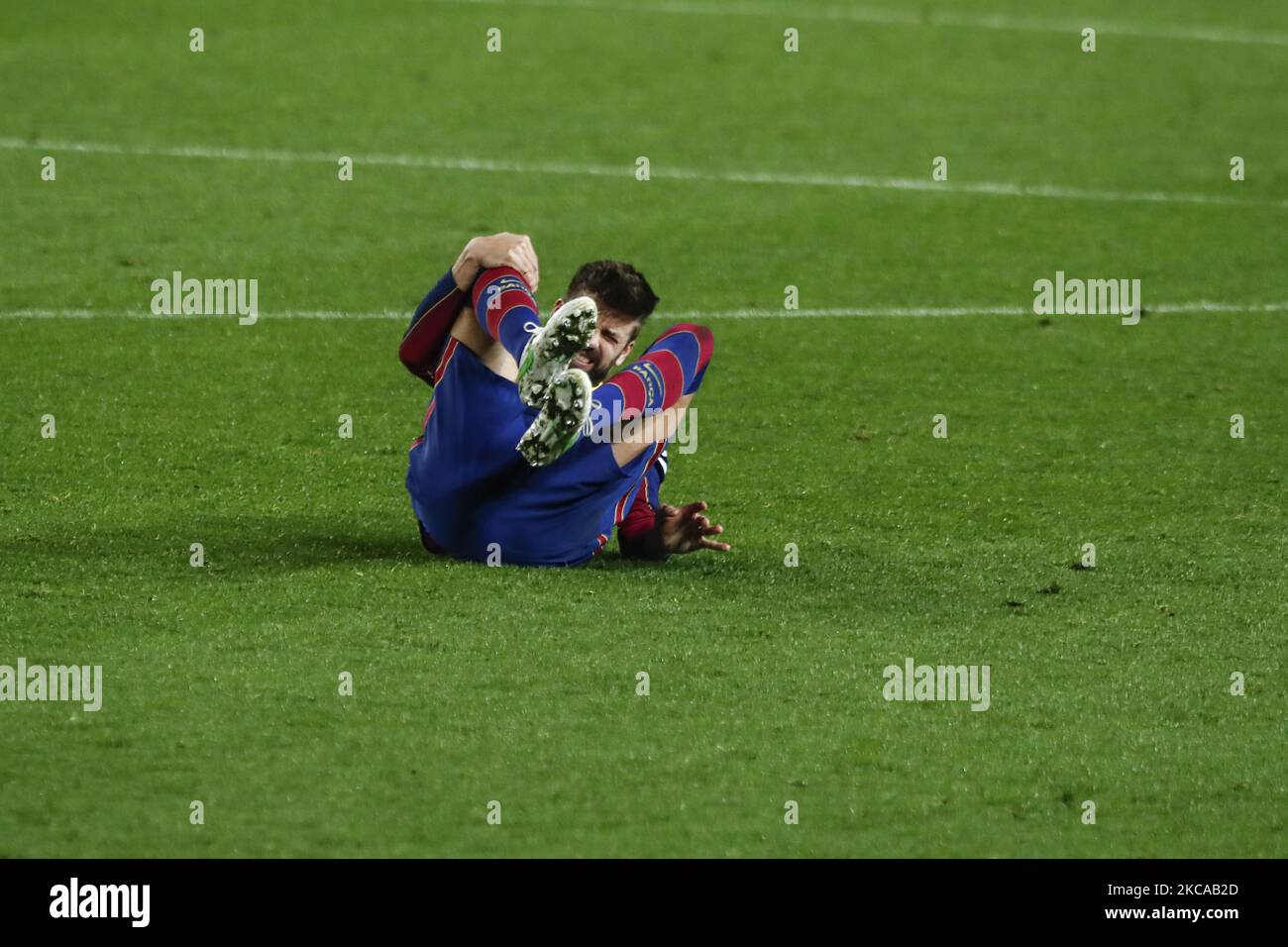 03 Gerard Pique of FC Barcelona with some pain at his injured knee ...