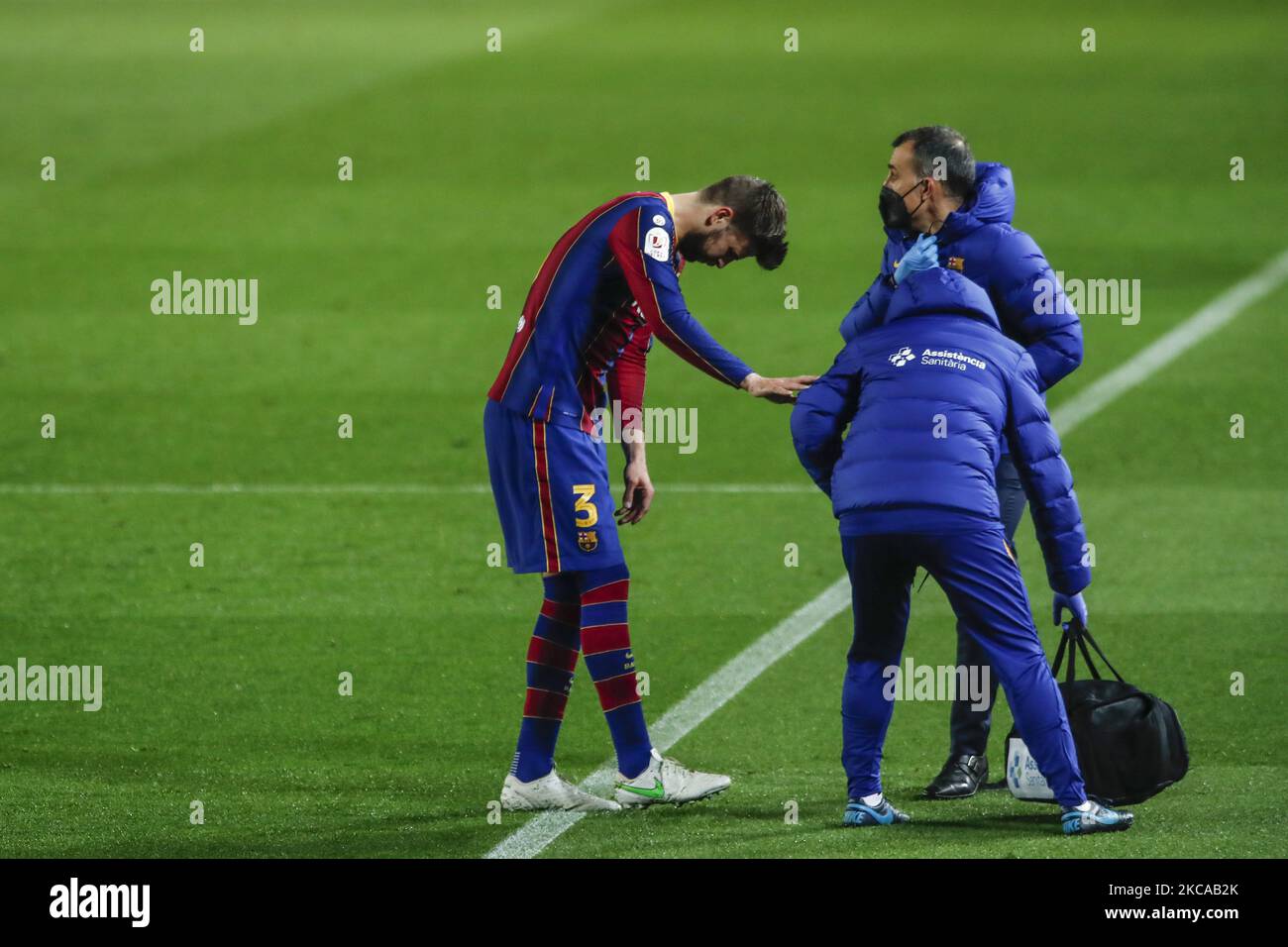 03 Gerard Pique of FC Barcelona with some pain at his injured knee ...