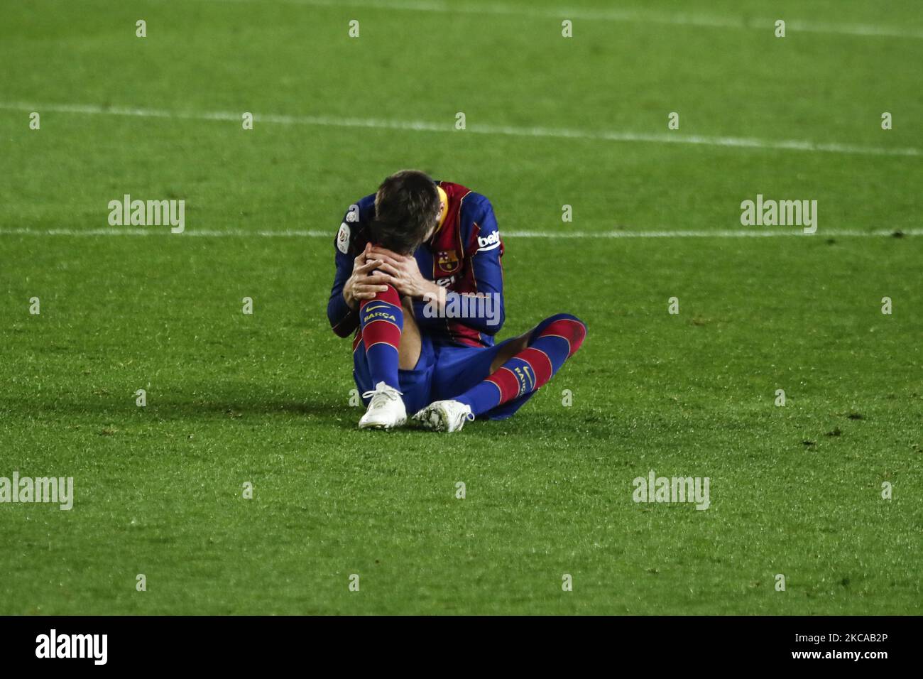 03 Gerard Pique of FC Barcelona with some pain at his injured knee ...