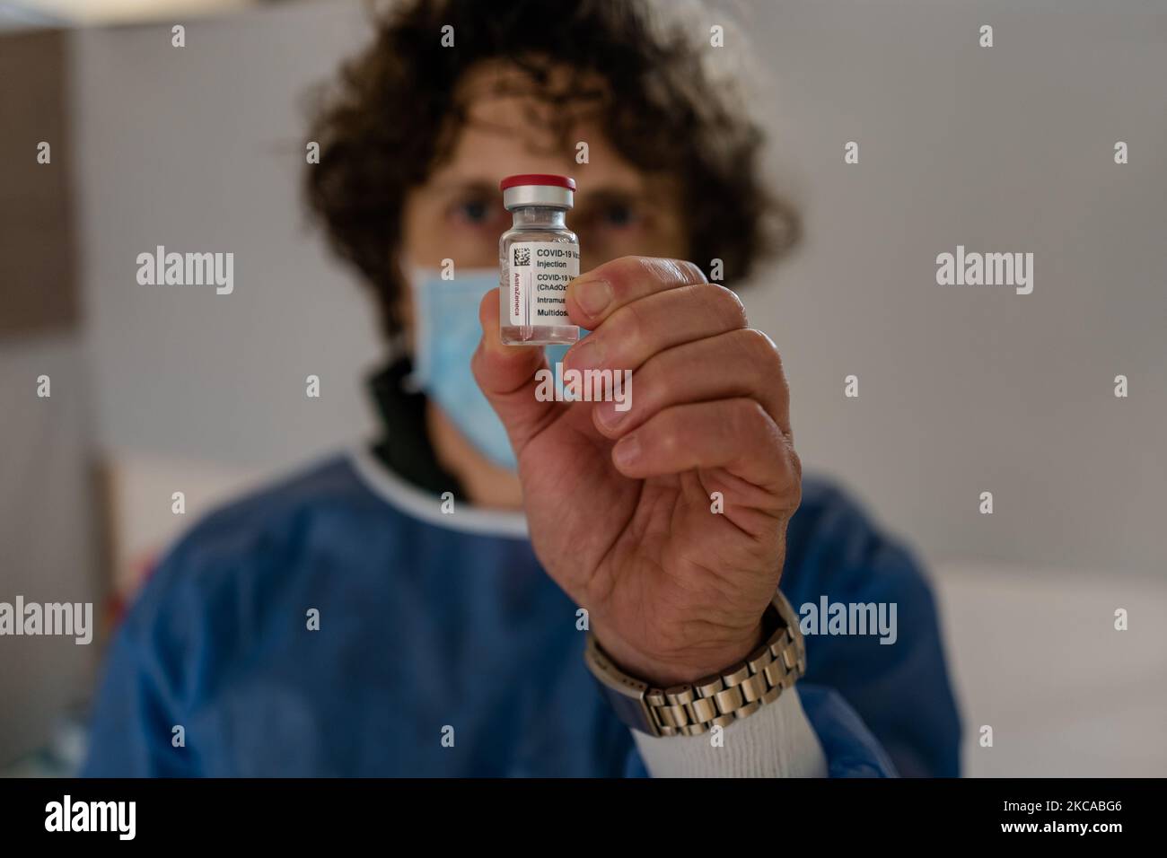 An ASL nurse shows the dose of AstraZeneca anti-Covid vaccine before ...
