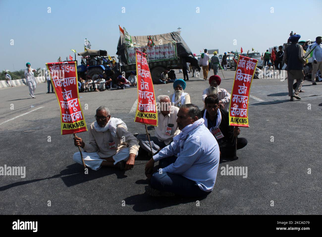 Farmers take part in a protest by blocking KMP expressway to mark 100 ...