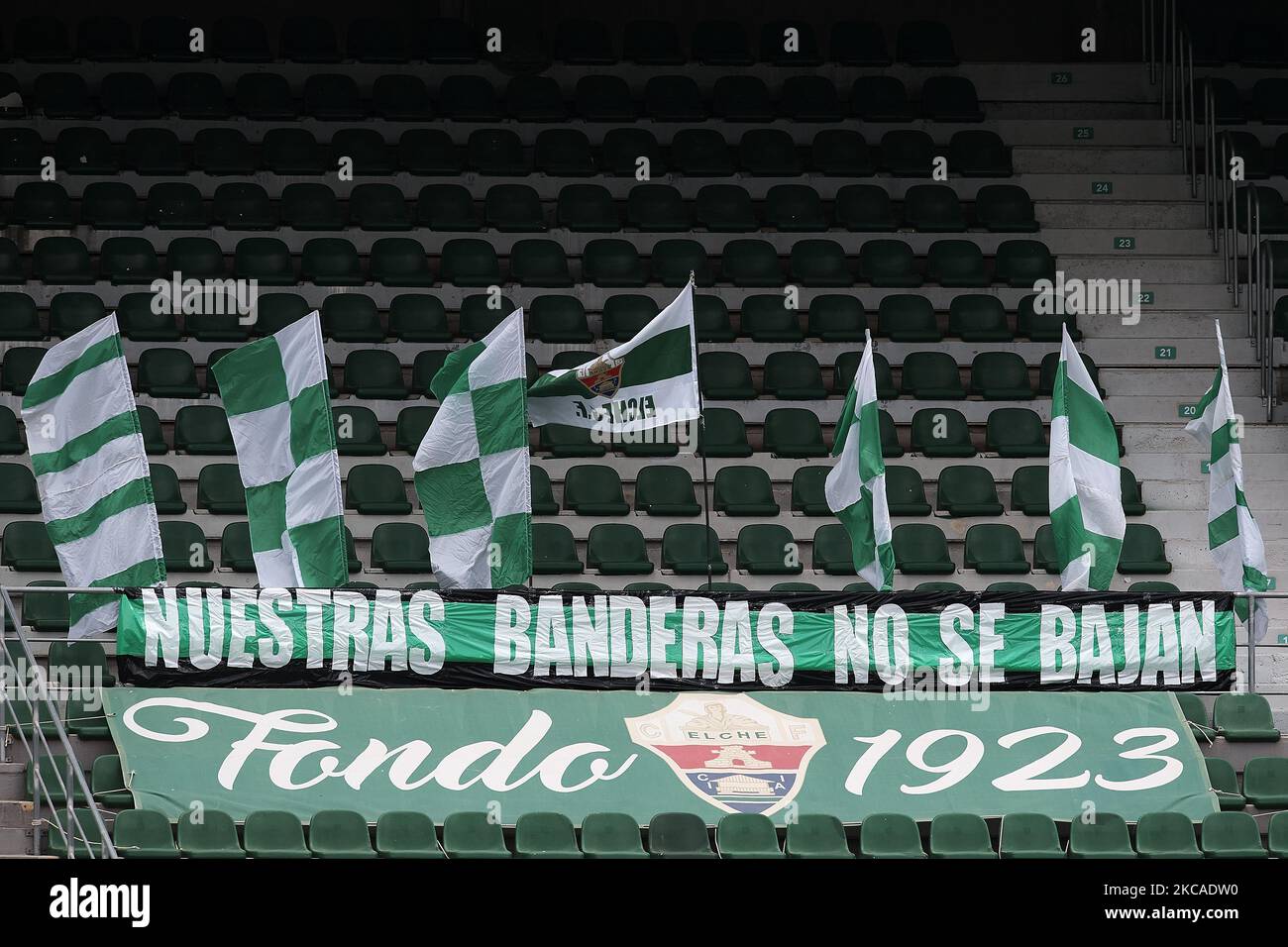 Flags and banners of the Elche fans with the empty stands of the ...