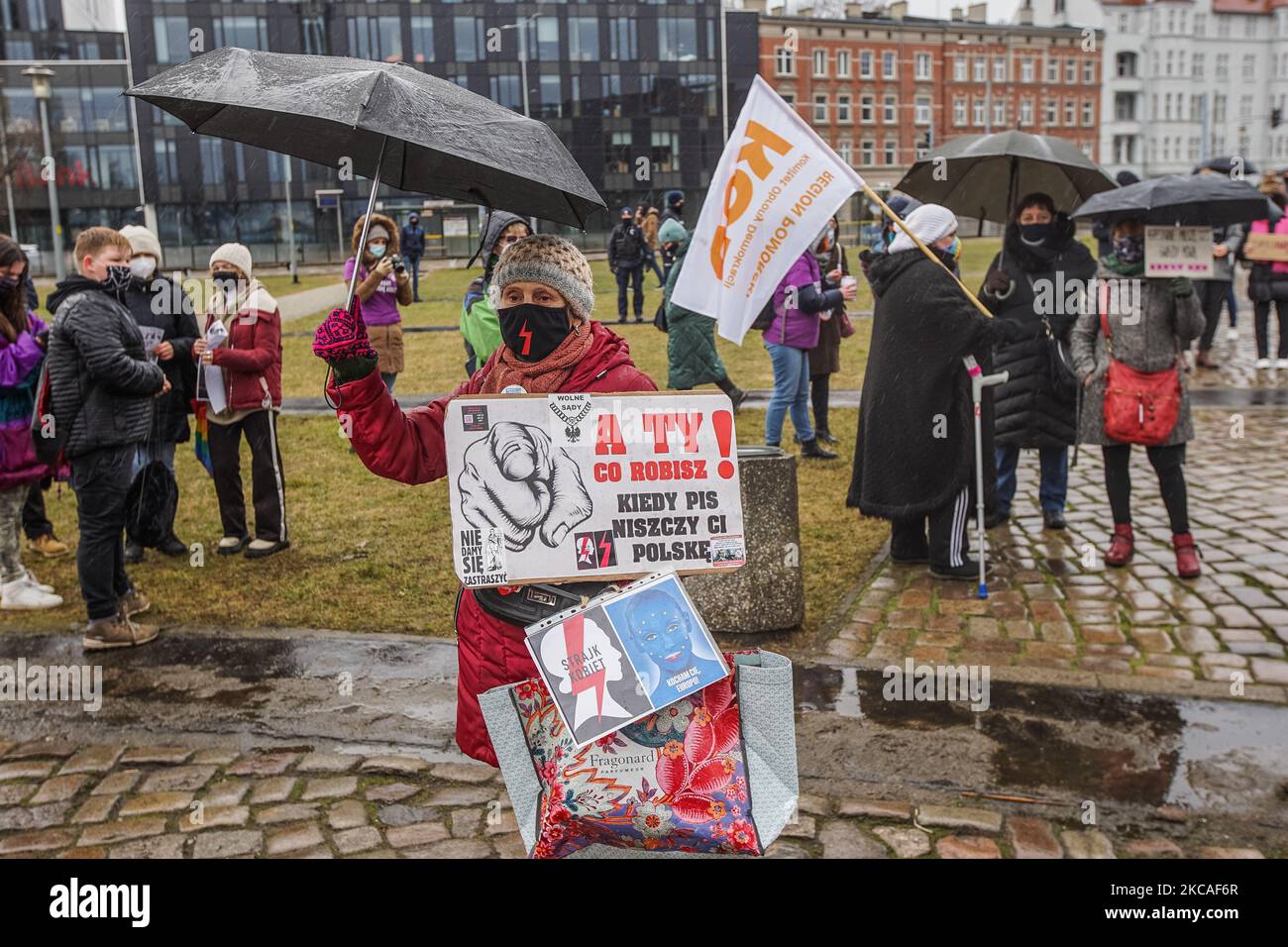 Protesters with feminist , pro-choice banners and LGBT movement rainbow ...