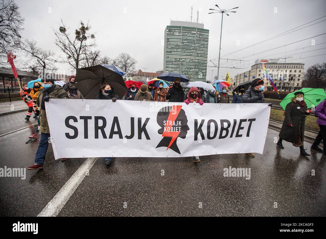 Protesters with feminist , pro-choice banners and LGBT movement rainbow ...