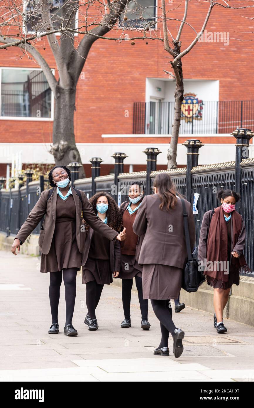 Students of Notre Dame secondary school walk out from the building ...