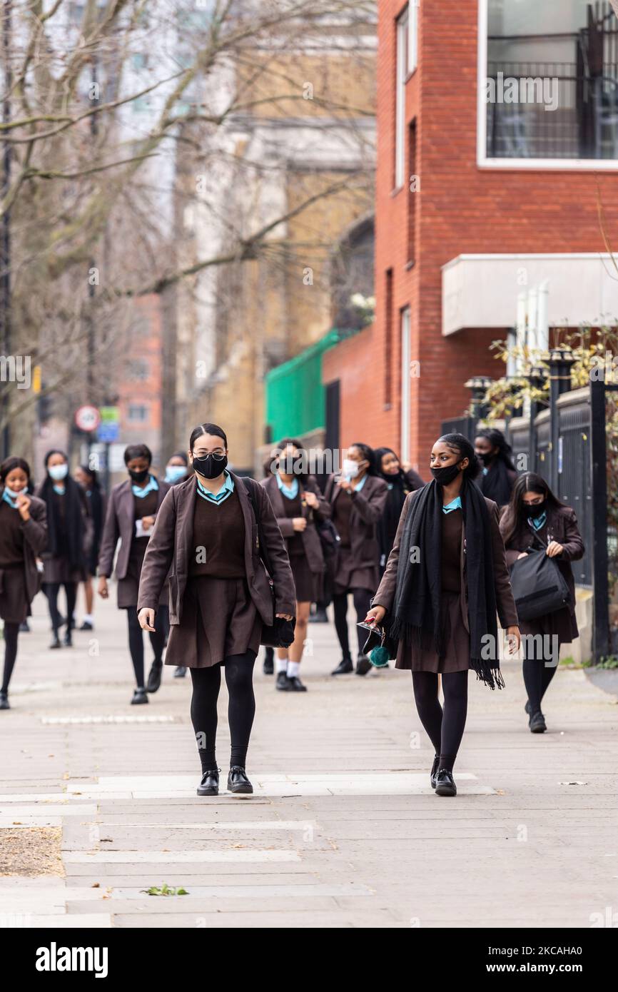 Students of Notre Dame secondary school walk out from the building ...