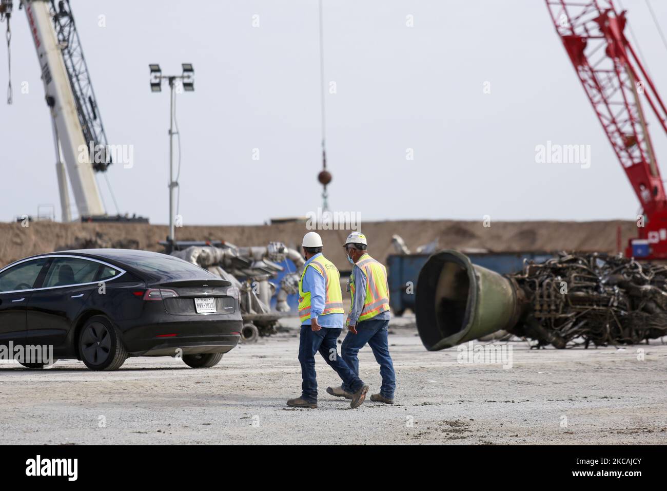 Engineers survey the destroyed Raptor engine from Starship SN-10’s ...