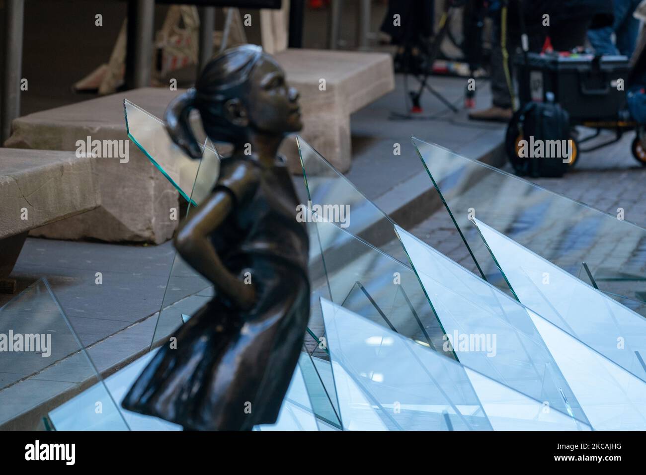 People stop to take photos of a broken glass ceiling installation in ...