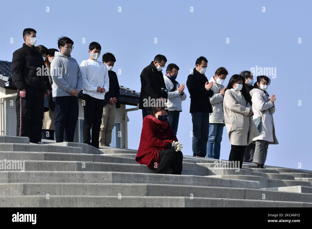 People pray for the victims of 3.11 disaster and observe a moment of ...