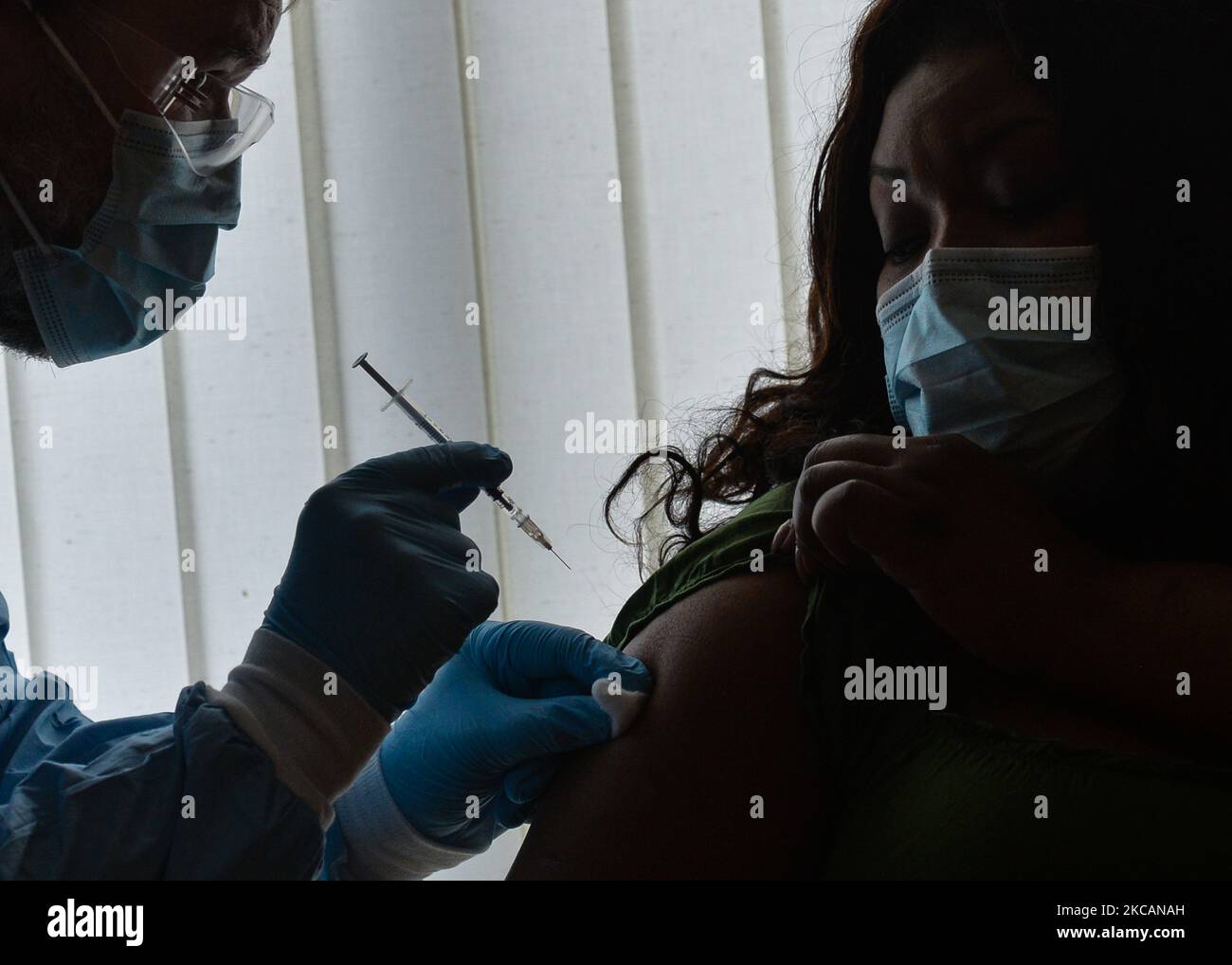 In this photo illustration a woman has an injection in her arm (PICTURE ...