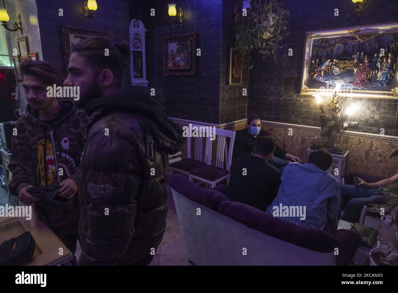 Iranian youth gather at a cafe to perform in a Game of Mafia, also ...