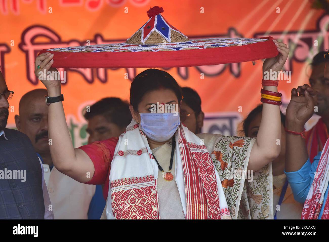 Union Minister Smriti Irani being presented an Assamese japi during an ...