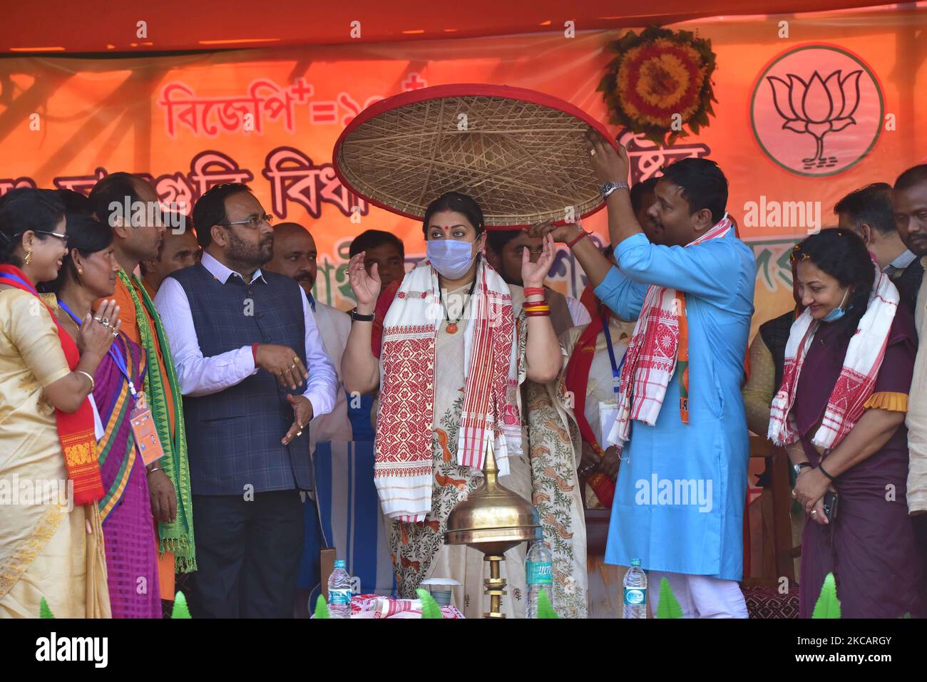 Union Minister Smriti Irani being presented an Assamese japi during an ...