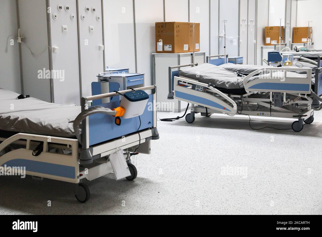Hospital beds and rooms are under preparation inside a temporary ...