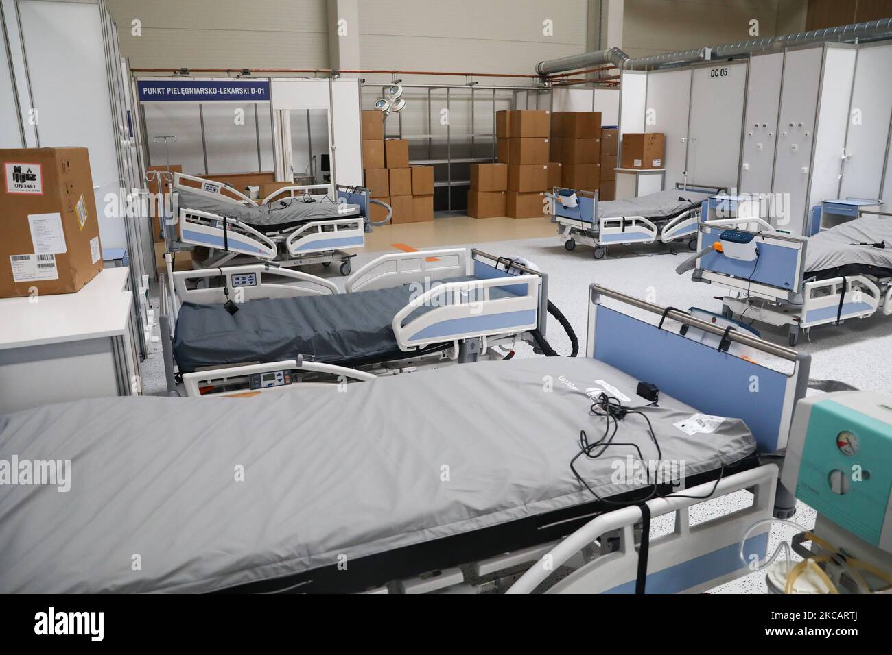 Hospital beds and rooms are under preparation inside a temporary ...