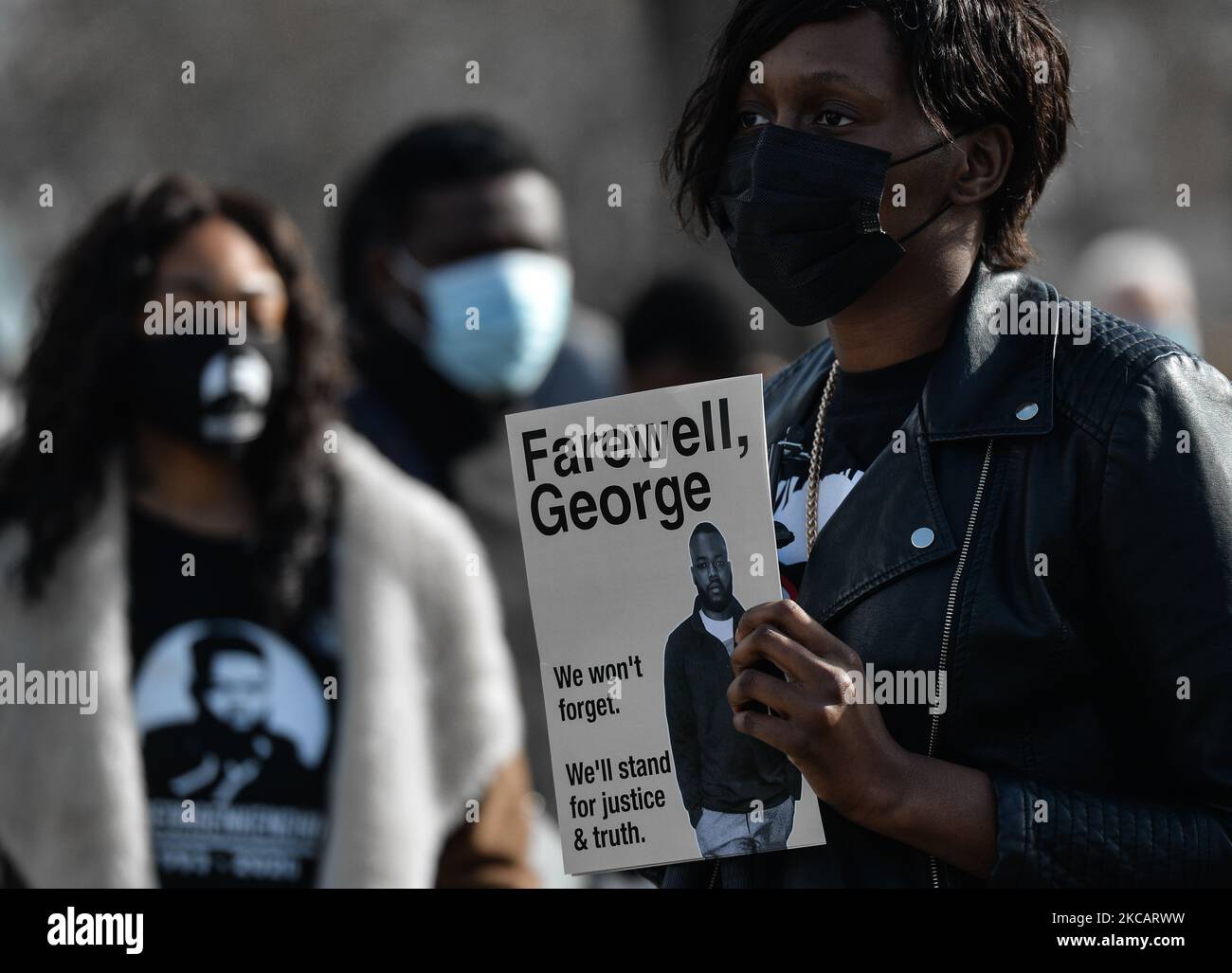 People gather outside the grounds of Sacred Heart of Jesus Church in ...