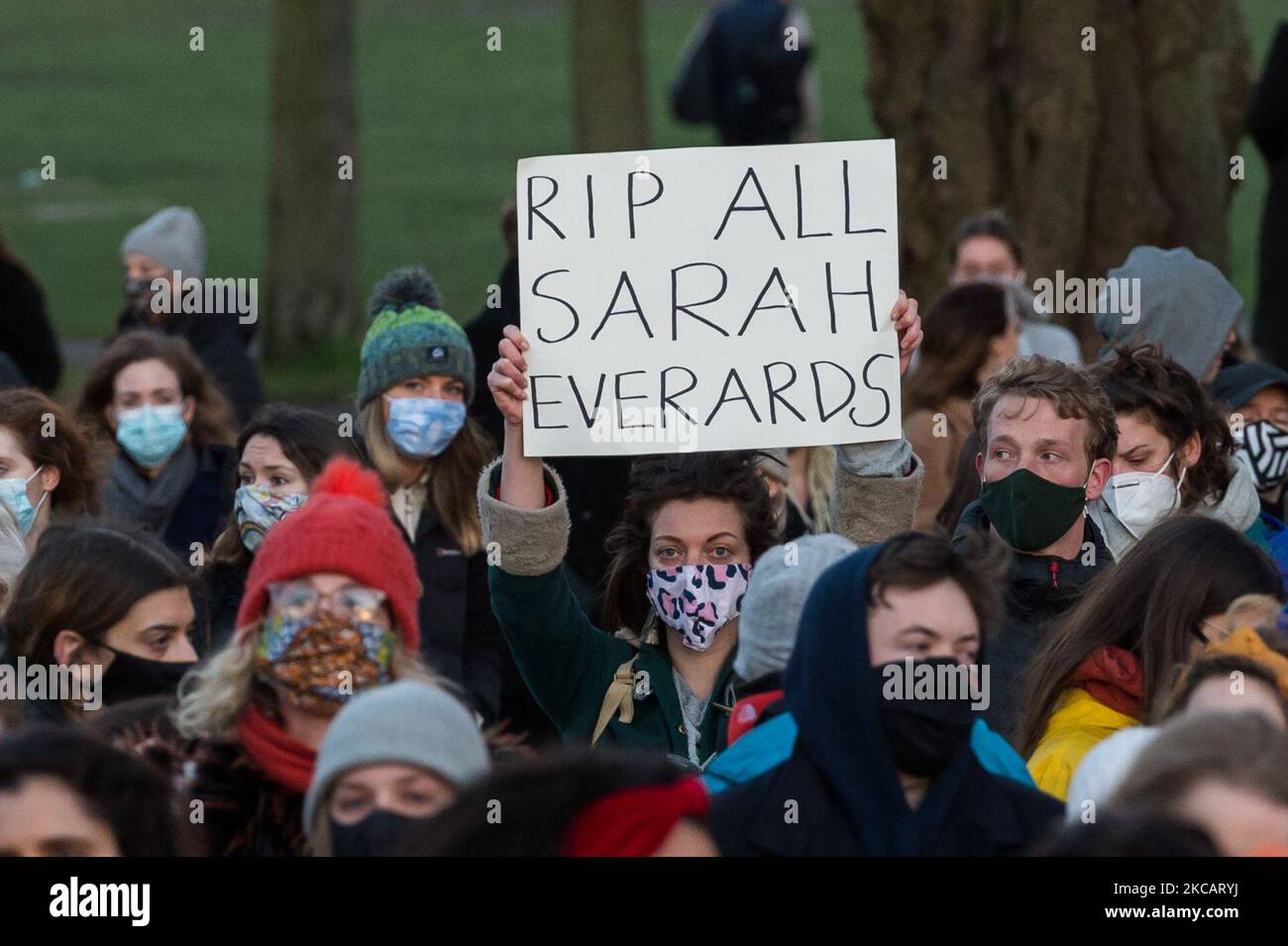 LONDON, UNITED KINGDOM - MARCH 13, 2021: A woman holds a placard ...