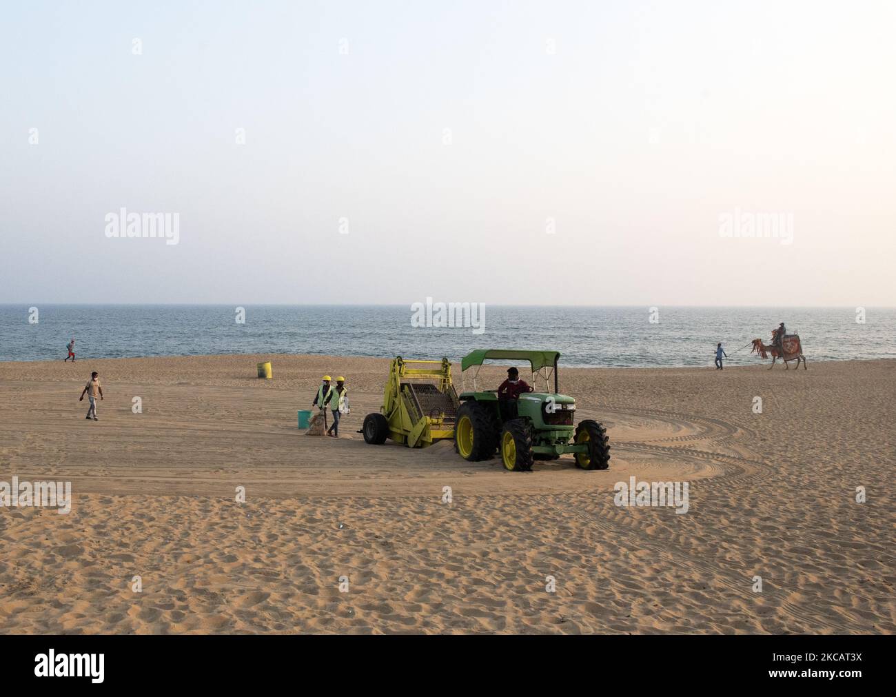 Workers extract sand at a sea beach in Puri, India, 11 December, 2020 ...
