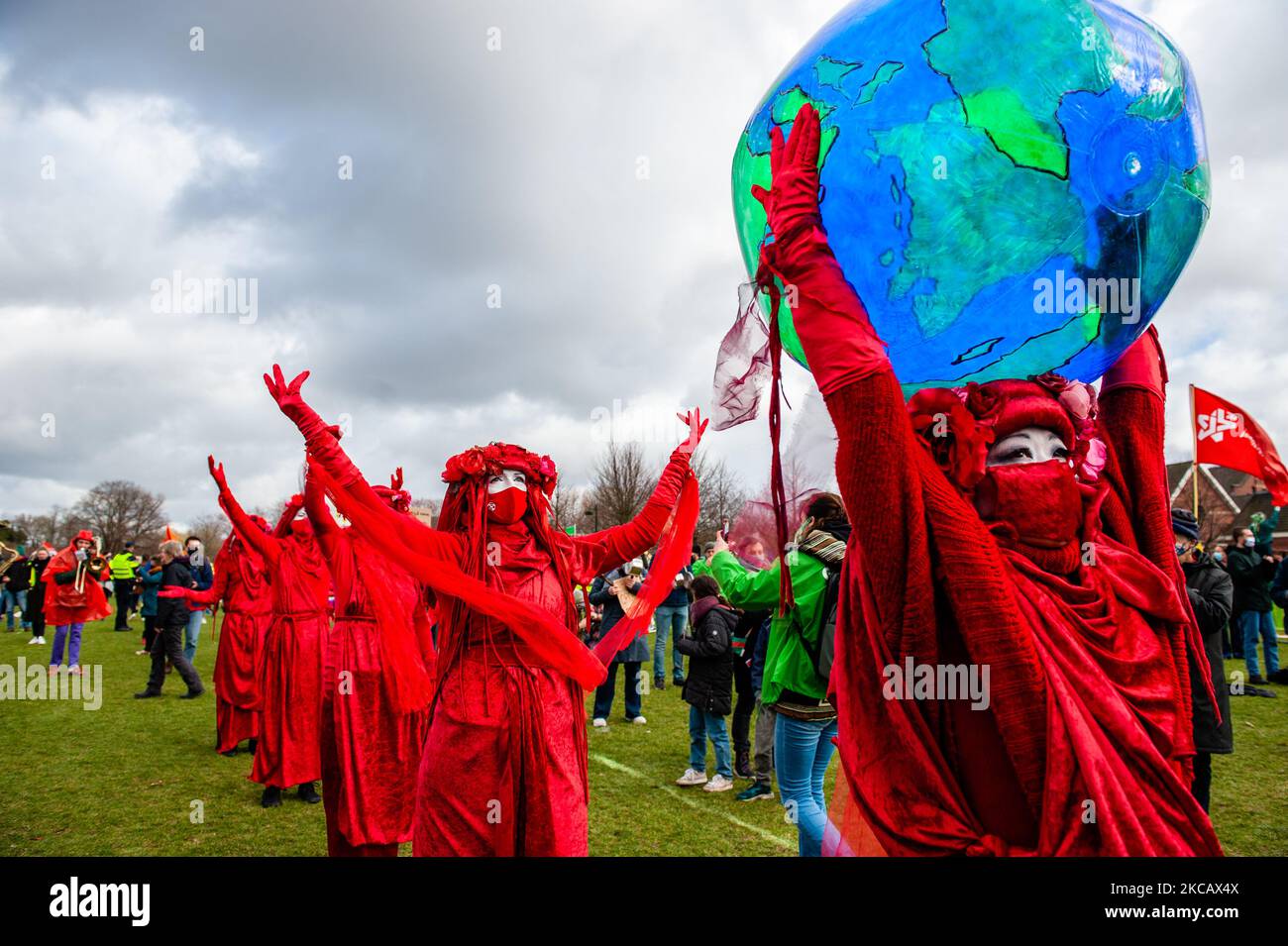 The Red Rebels are performing with an earth ballon, during the Nationwide Climate Alarm held in ...