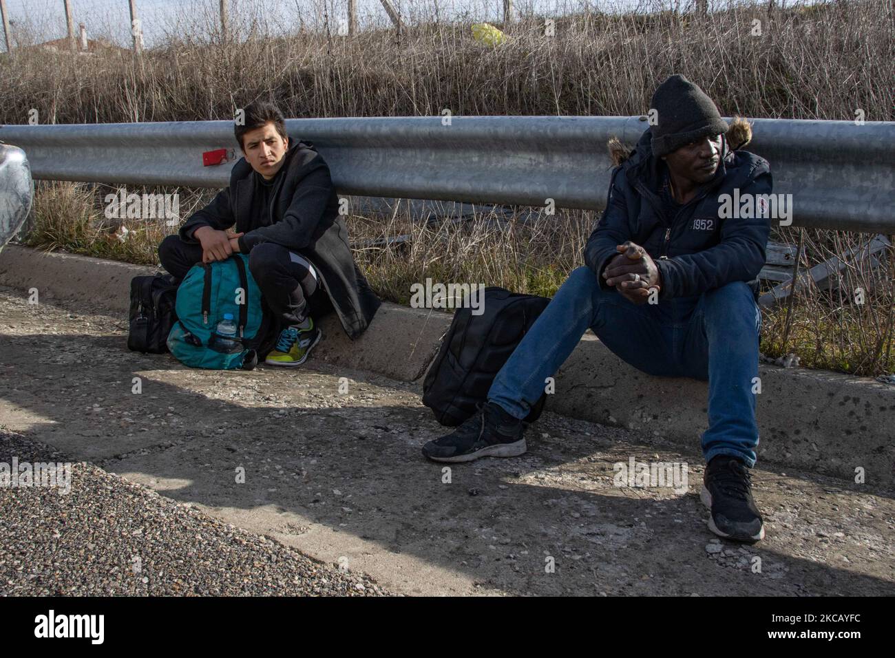 Police cars and law enforcement officers are seen holding 2 ...