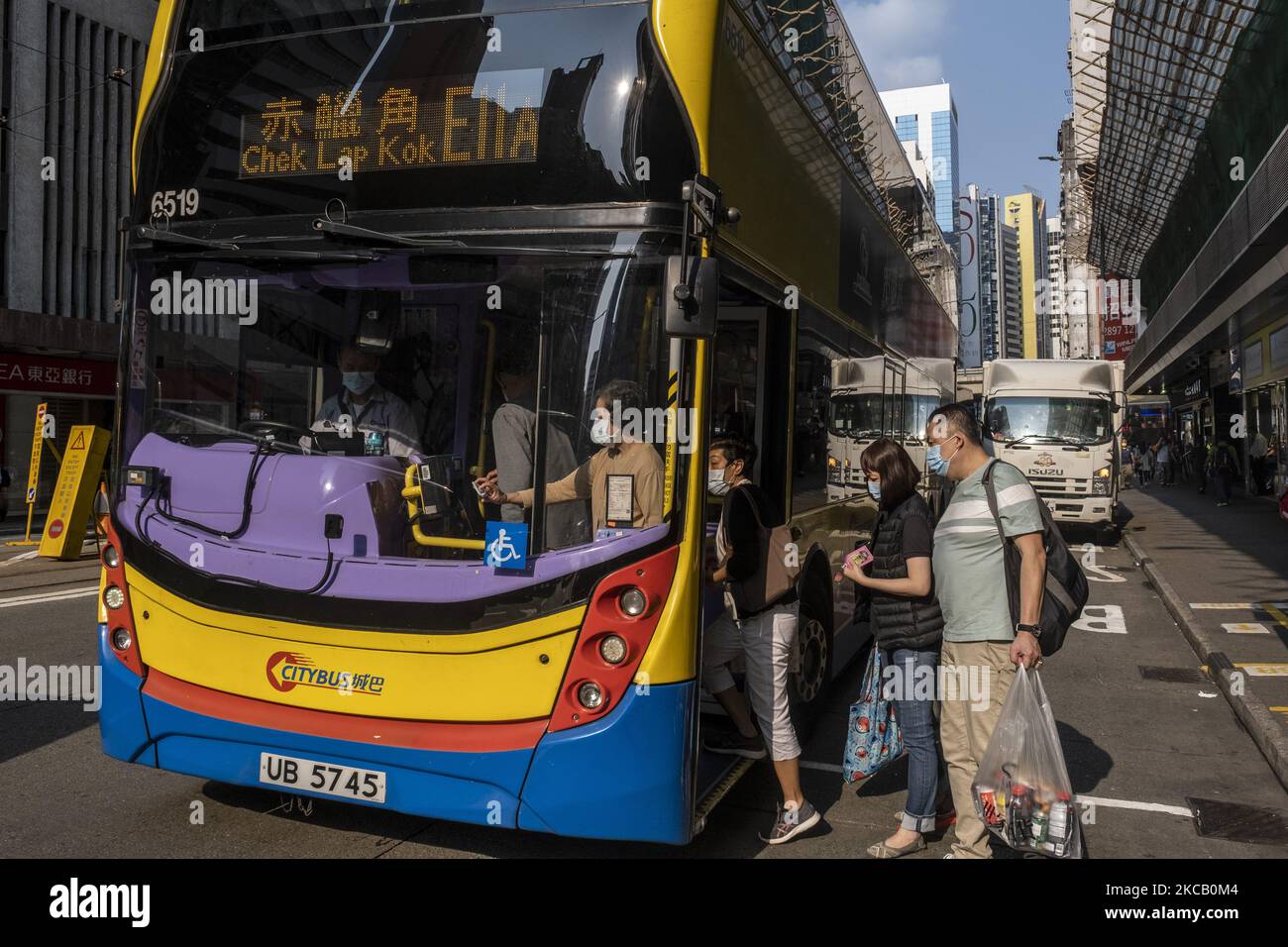 Commuters board a bus operated by Citybus in Hong Kong, Tuesday, March ...