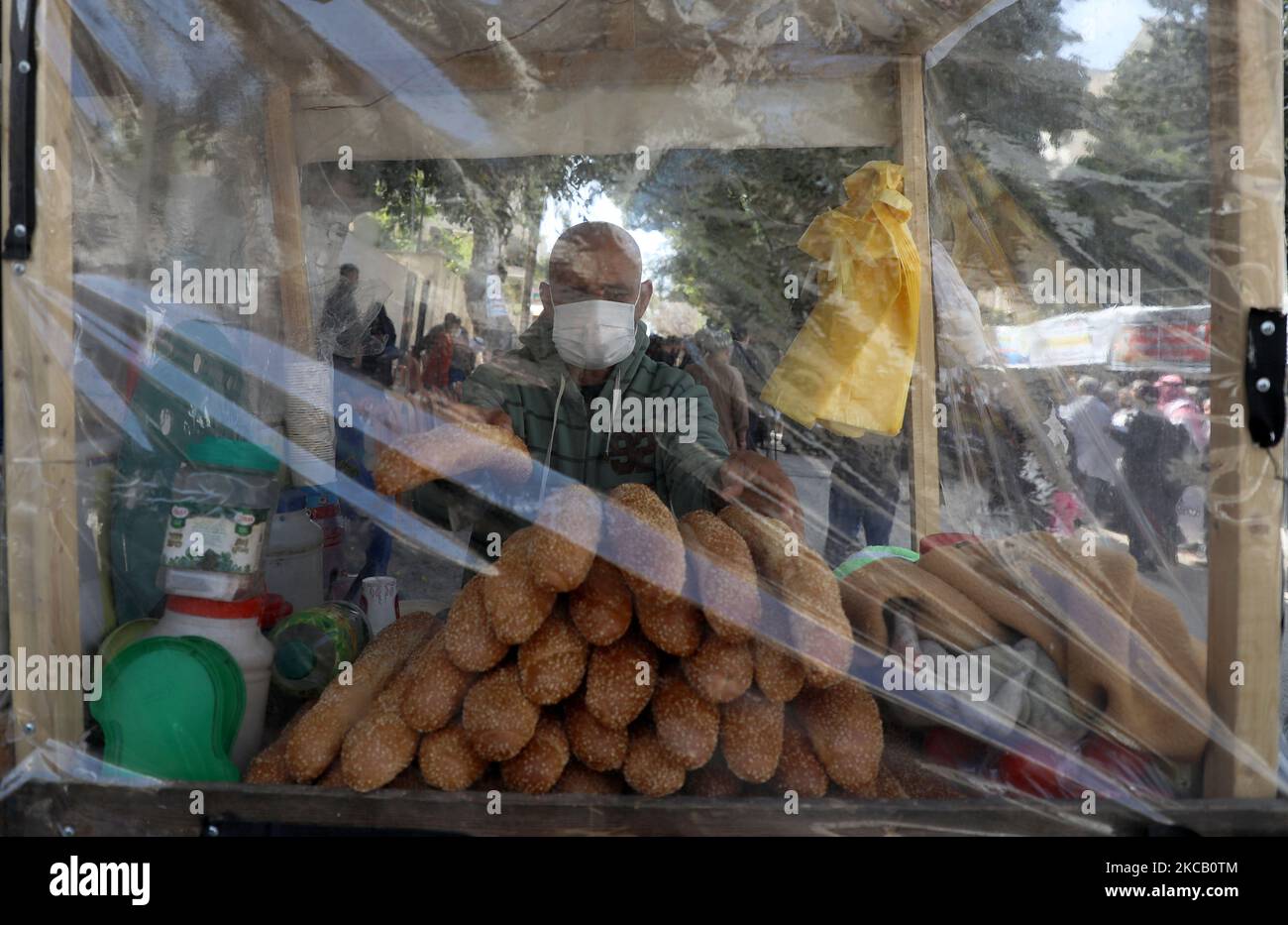 A Palestinian man sold bread in Gaza City on March 16, 2021. (Photo by ...